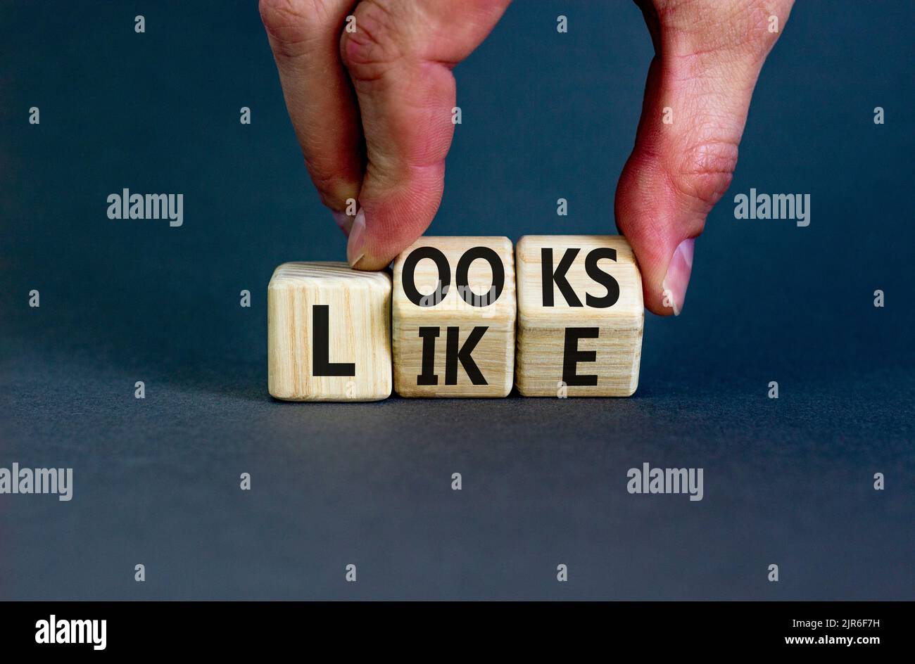 Looks like symbol. Concept words Looks like on wooden cubes ...