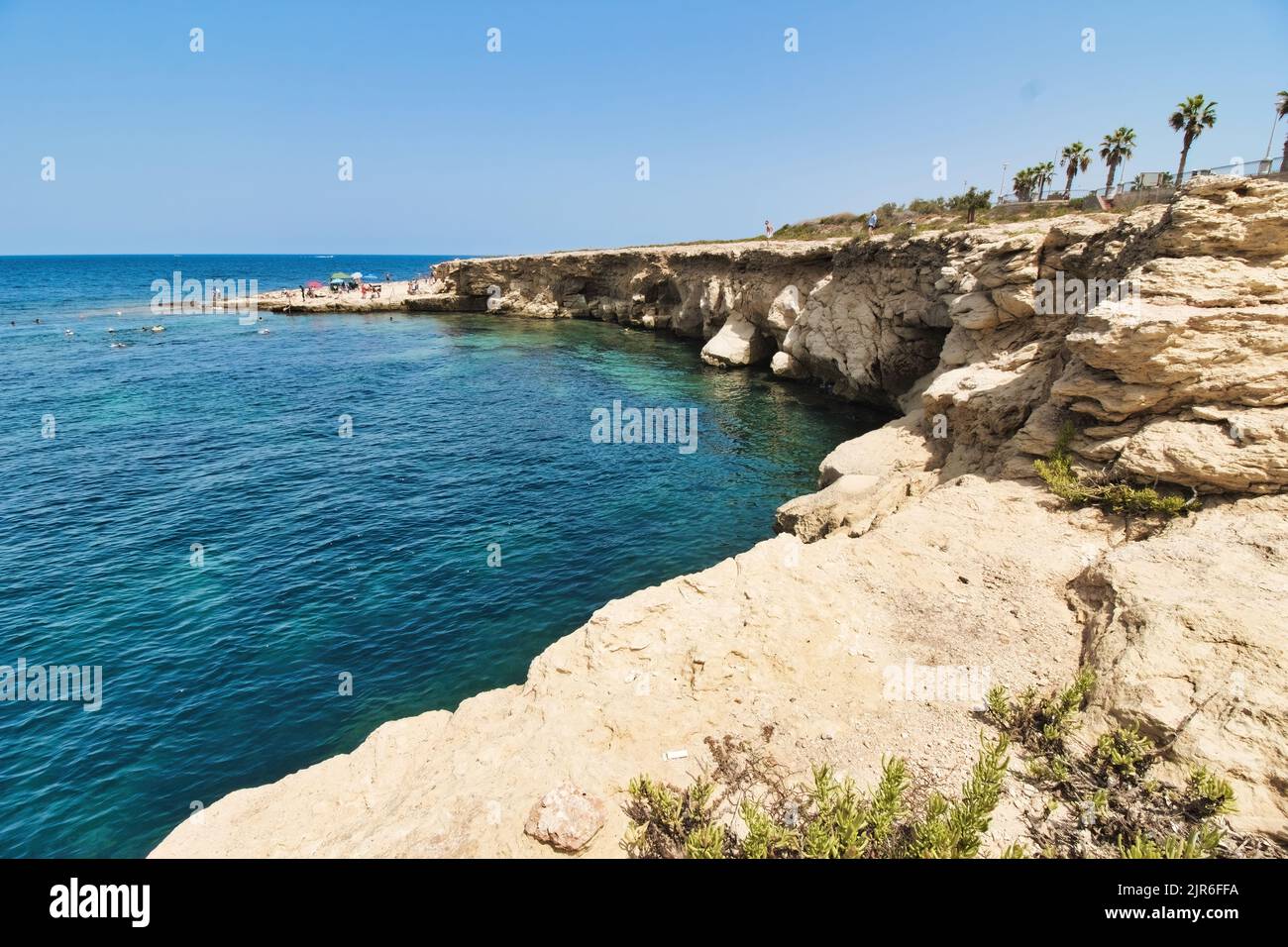 An rocky cliff inlet on the coast of Bugibba, St. Paul's Bay in Malta ...