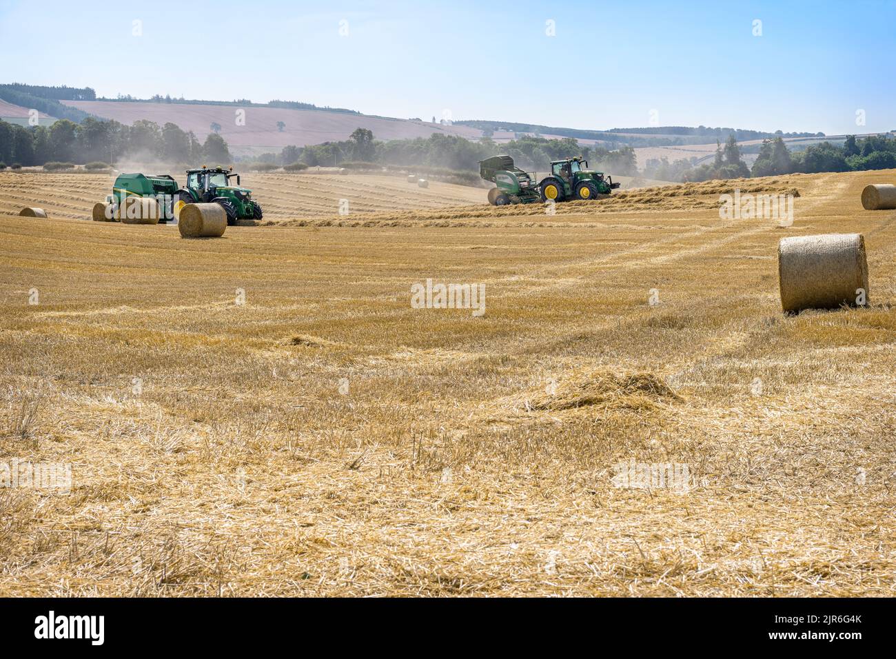 Hay Balers at work after the harvest, Scottish Borders, United Kingdom ...