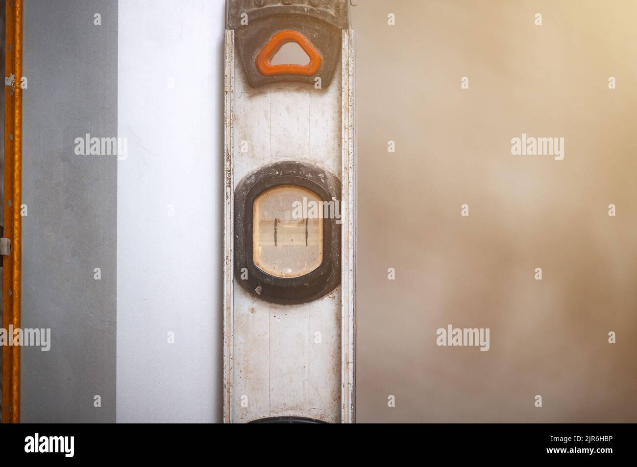 metal guide beacons are attached to the wall, the master checks the ...