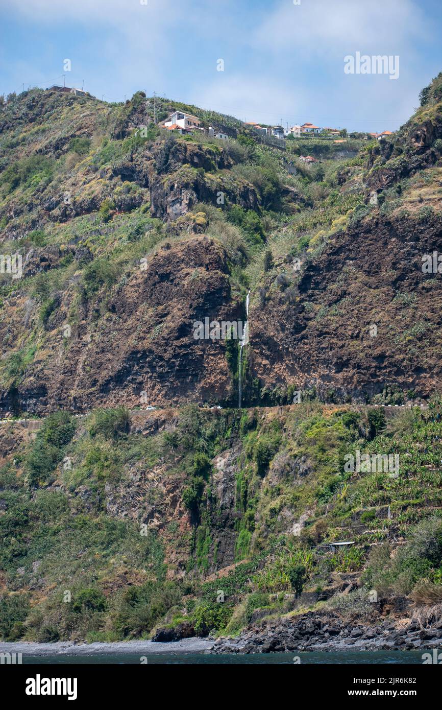 A vertical shot of a waterfall in Madeira Stock Photo - Alamy