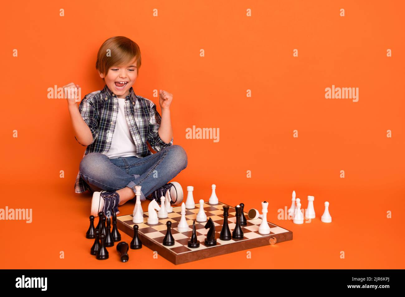 Full length photo of young excited boy rejoice victory fists hands ...