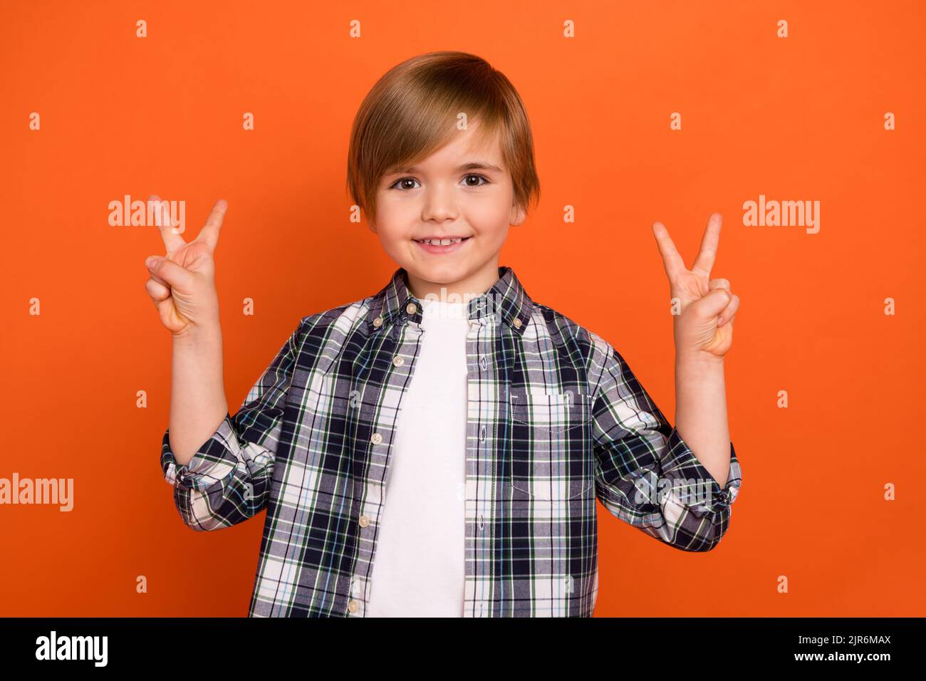 Photo of young cheerful boy good mood show fingers peace hello v-symbol ...