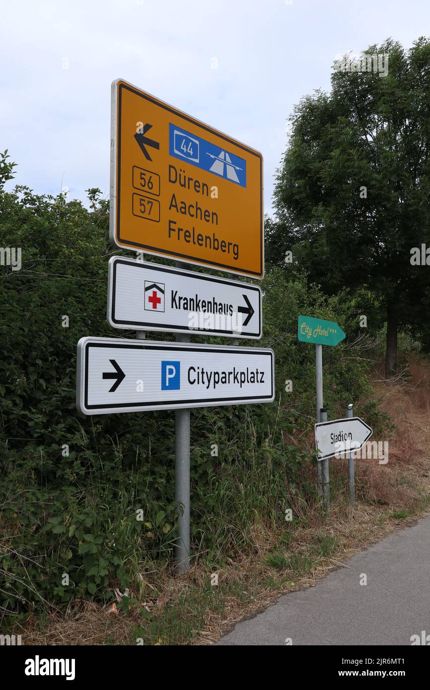 A view of several directional traffic signs on a street Stock Photo - Alamy