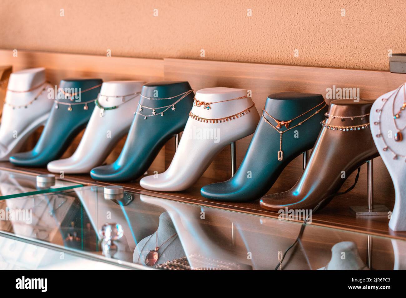 anklet or ankle bracelet on a mannequin foot in a jewelry store window. Similar accessory is ...