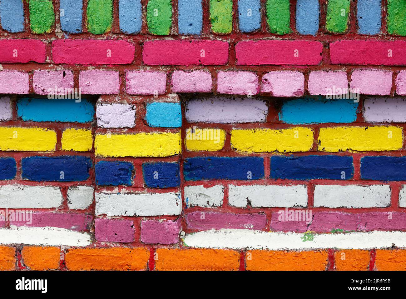 Close up of different coloured bricks forming a brick wall Stock Photo ...
