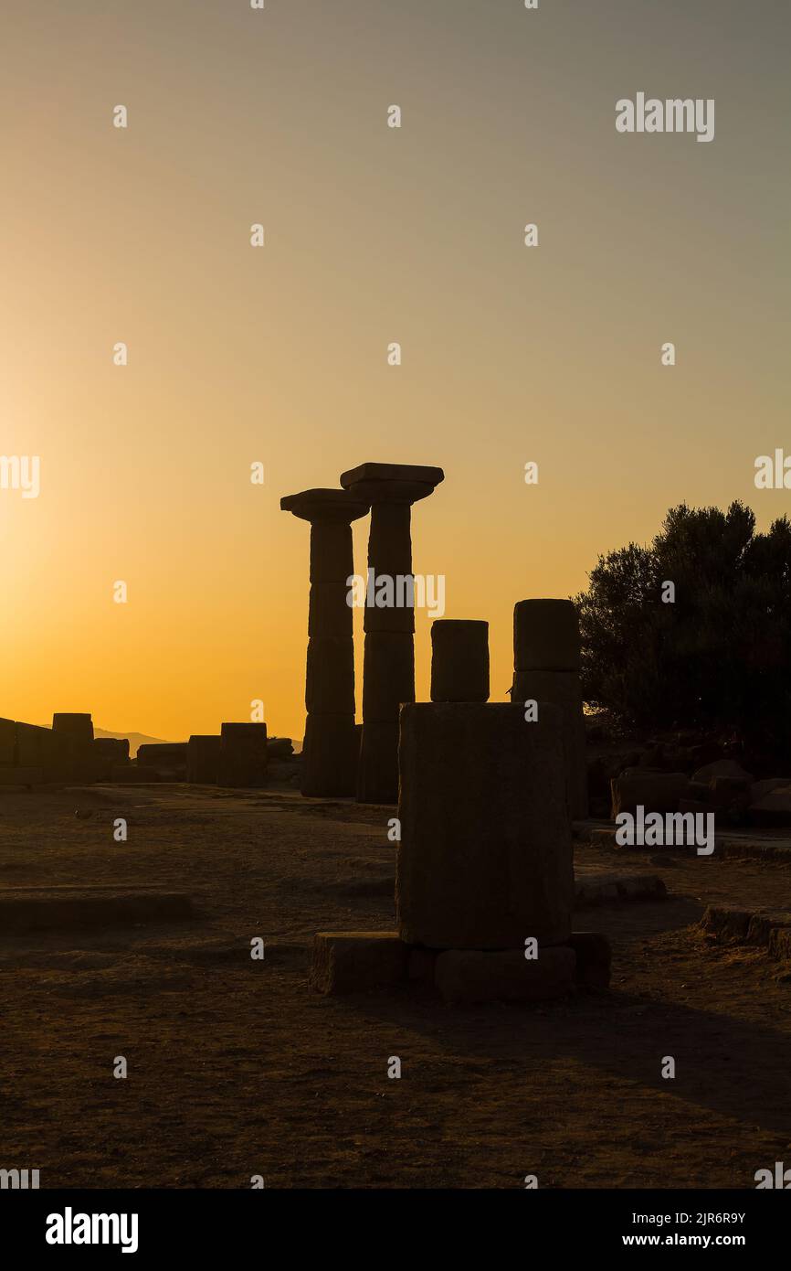 View of historical ruins at sunset captured in the temple of Athena at ...