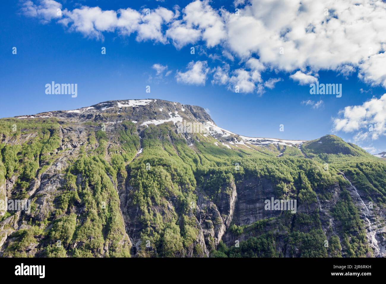 Beautiful and imposing Norwegian fjord in spring with its waterfalls ...
