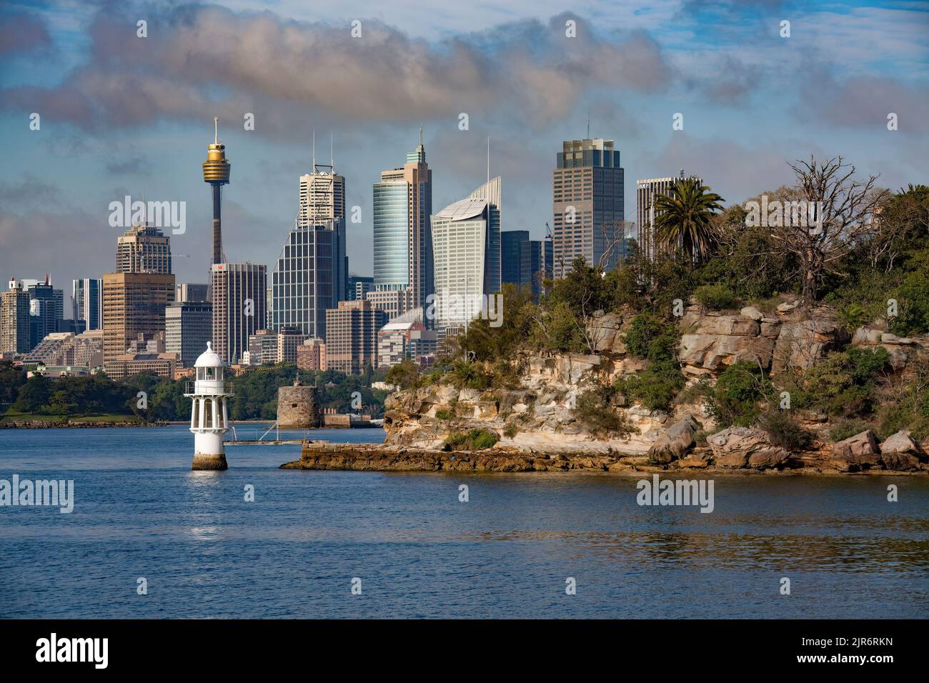 A beautiful view of Bradley's Head Lighthouse with Sydney's cityscape ...