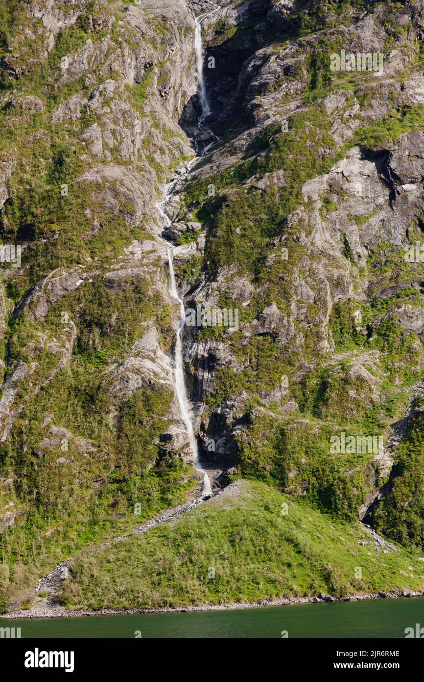 Beautiful and imposing Norwegian fjord in spring with its waterfalls ...