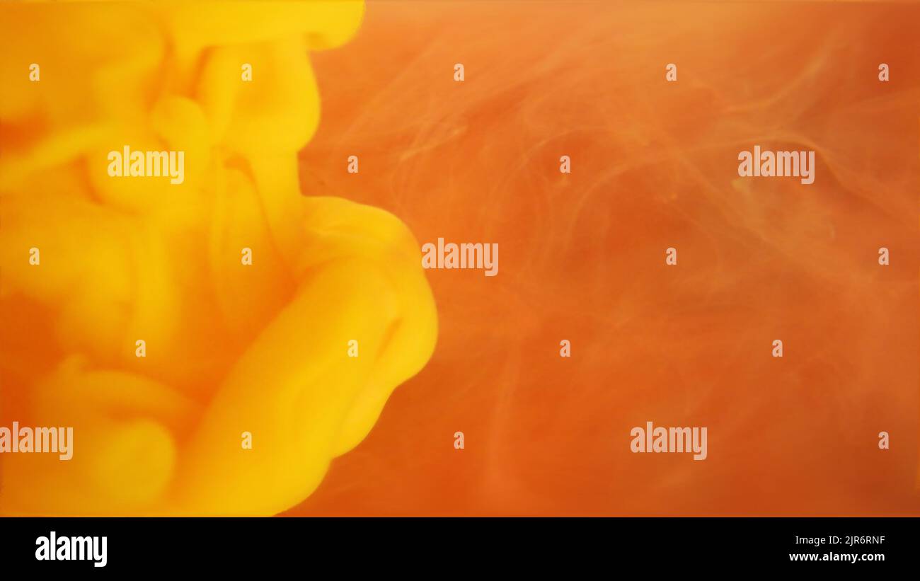 Paints in water, slow motion. Splashes of colored ink, bright colors ...