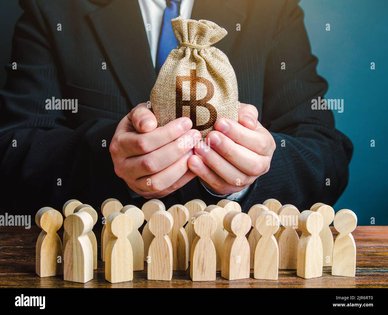 Businessman holds out a thai baht money bag to the crowd. Official ...