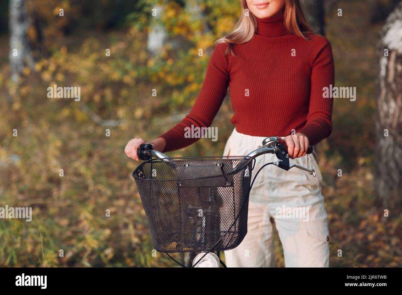 Happy active young woman ride bicycle in autumn park. Fall season Stock ...