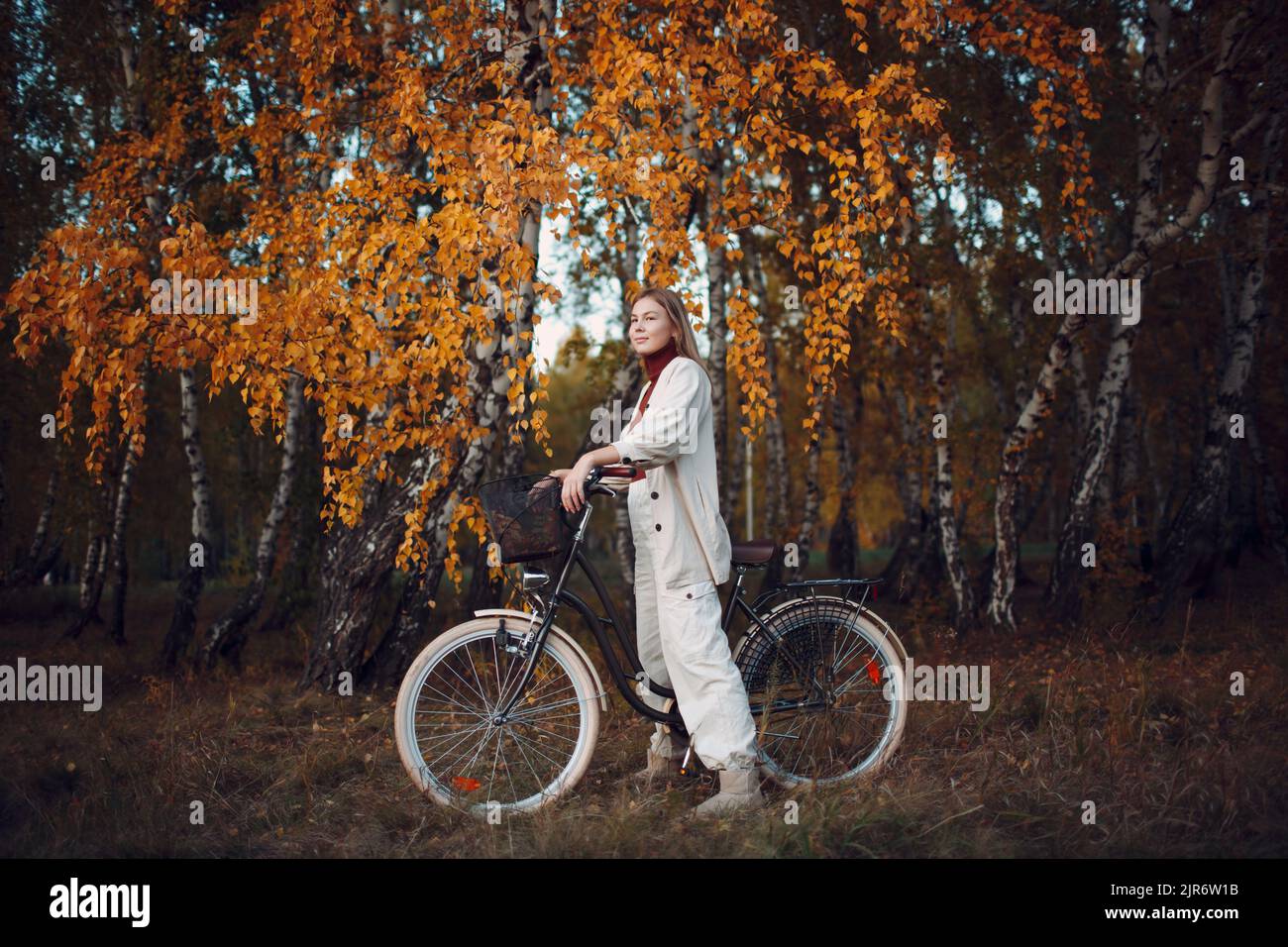 Happy active young woman ride bicycle in autumn park. Fall season Stock ...