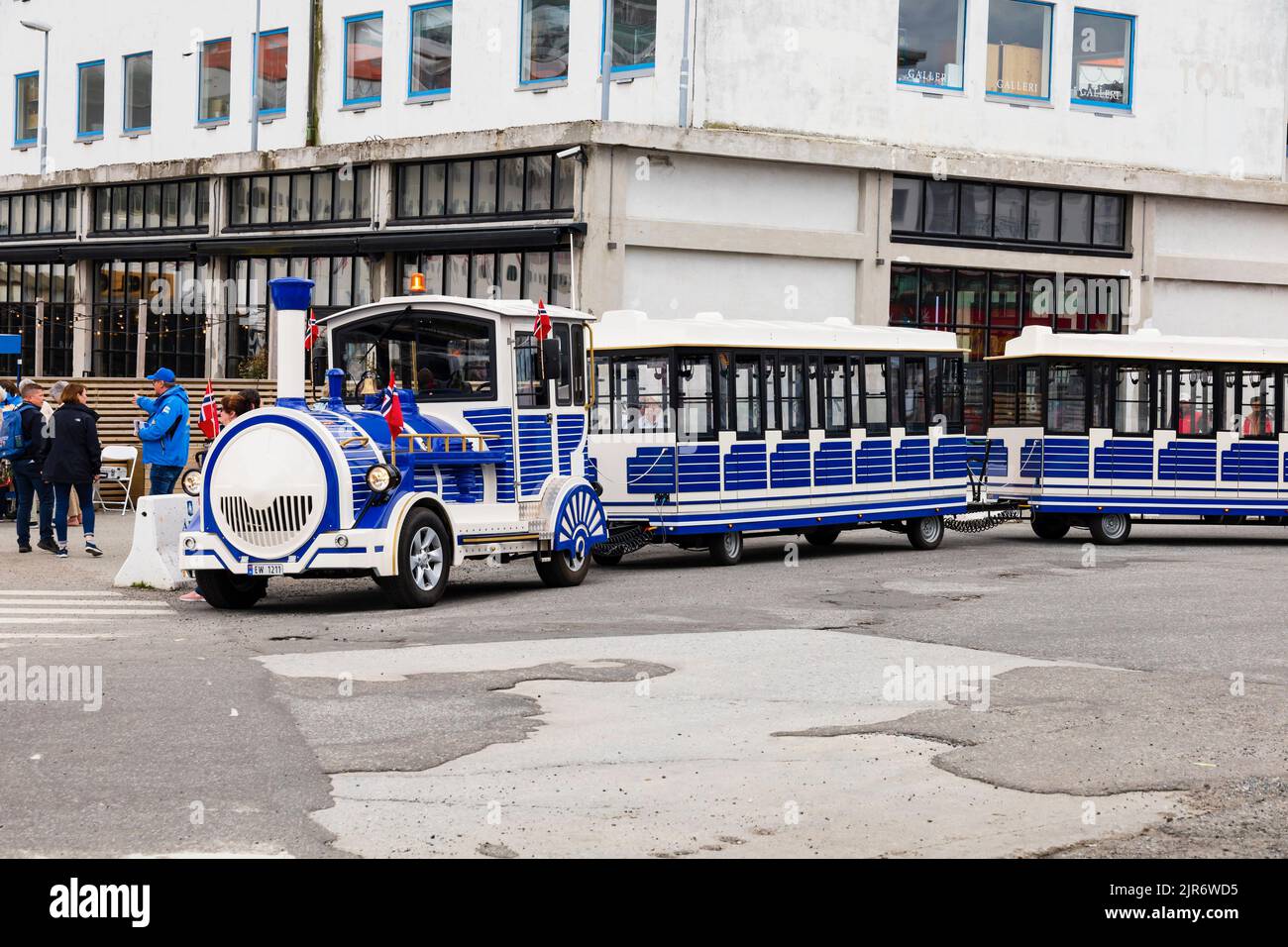 Land train waiting for tourist from a cruise ship docked at Alesund ...
