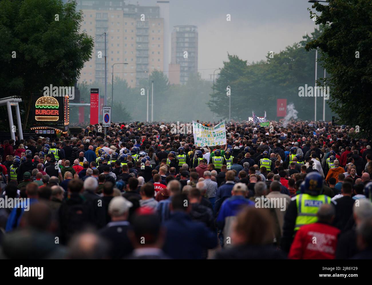 Fans take part in an organised protest march outside the ground against ...