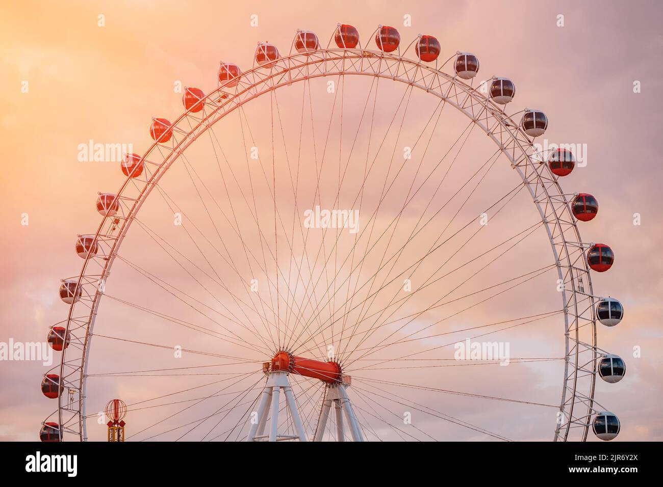 Ferris wheel in amusement park against sky background. Entertainment ...