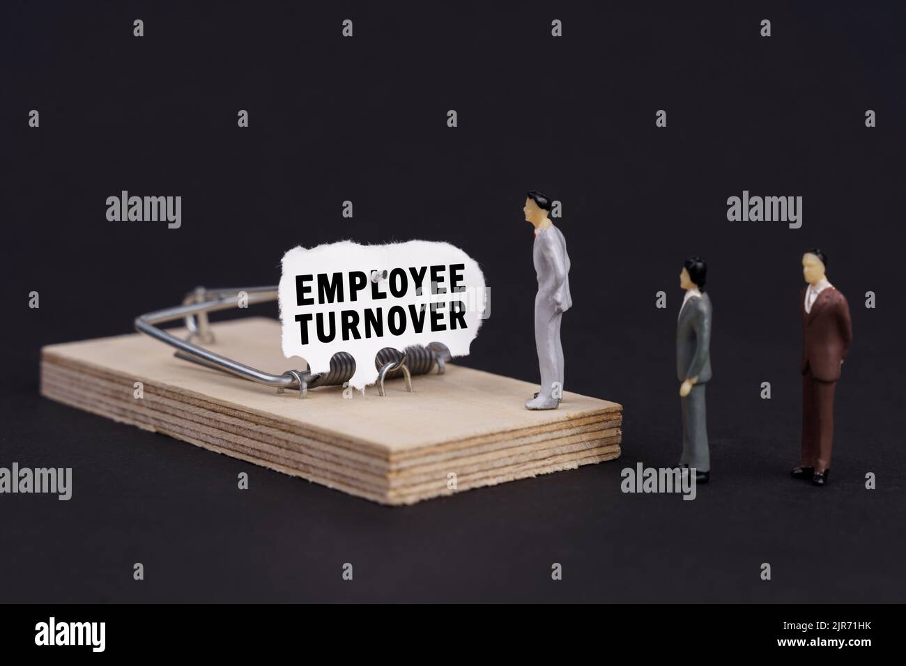 Business trap, crisis concept. Figures of businessmen stand near a ...