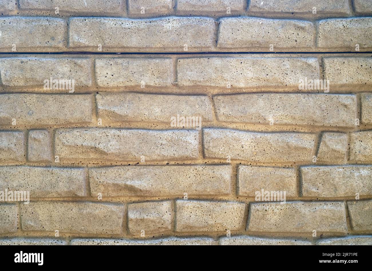Background texture of stone - brick decoration of the facade of the ...