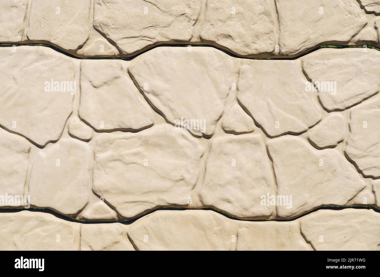 Background wall texture with large stone tiles in light colors ...