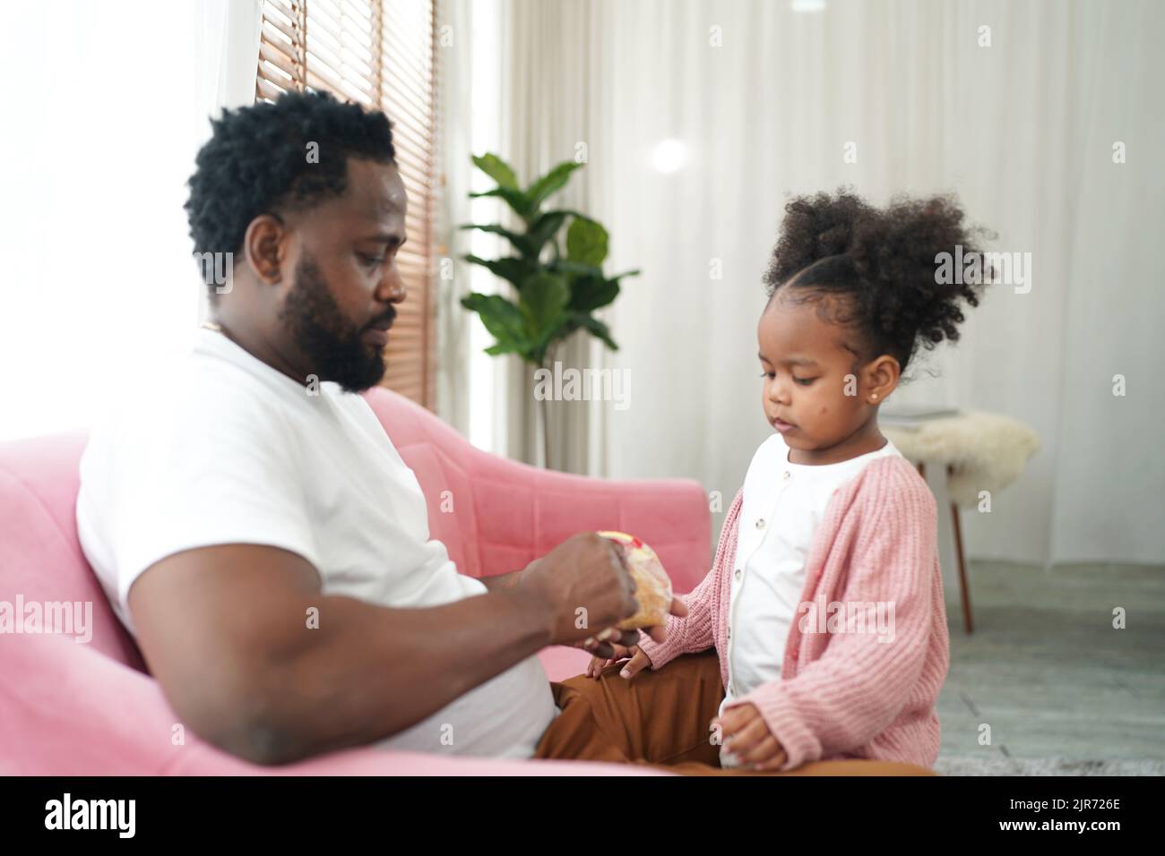 Shot of happy interracial family of mother father and their daughter ...