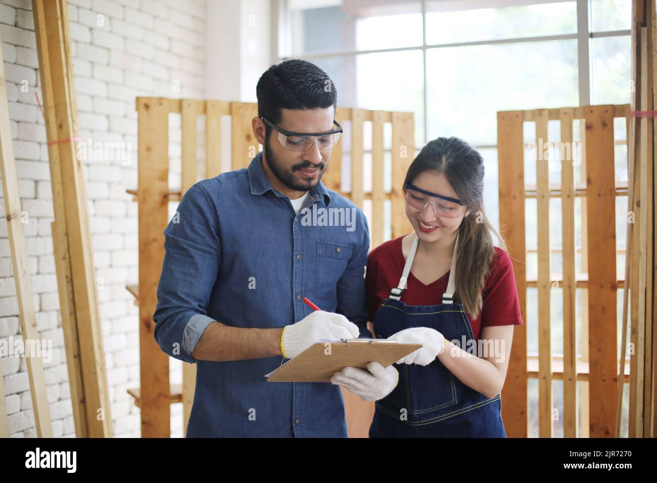 Carpenter grinding joinery product with carvings, finishing woodwork at ...