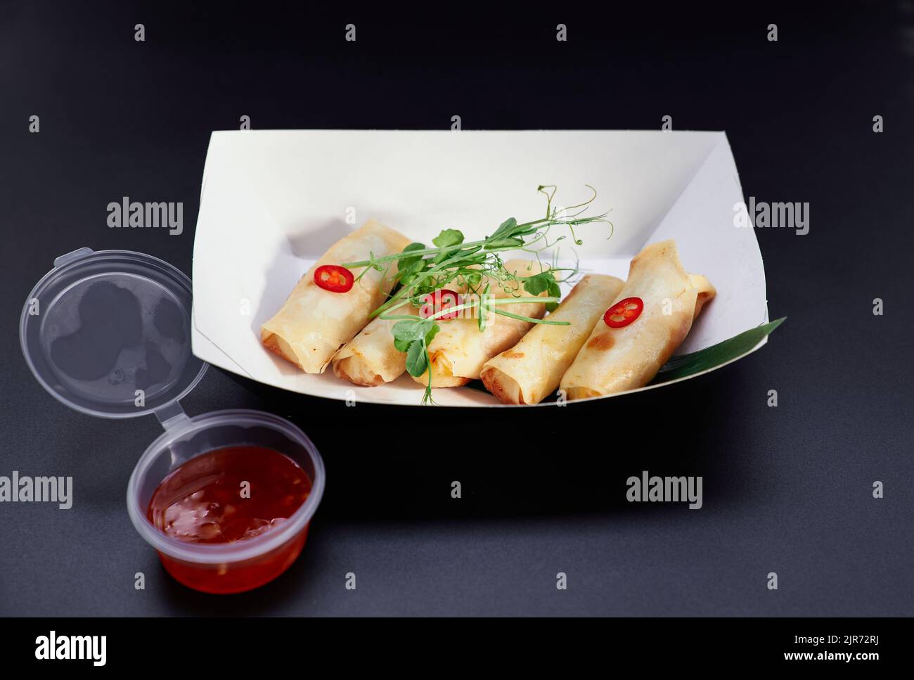 Chinese or Thai traditional asian street food: deep fried spring rolls ...