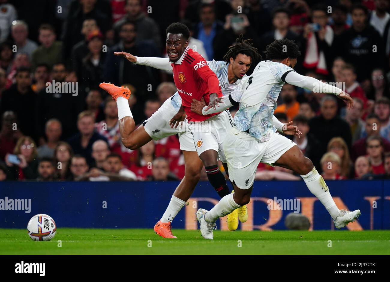 Manchester United's Anthony Elanga (left) is fouled by Liverpool's ...
