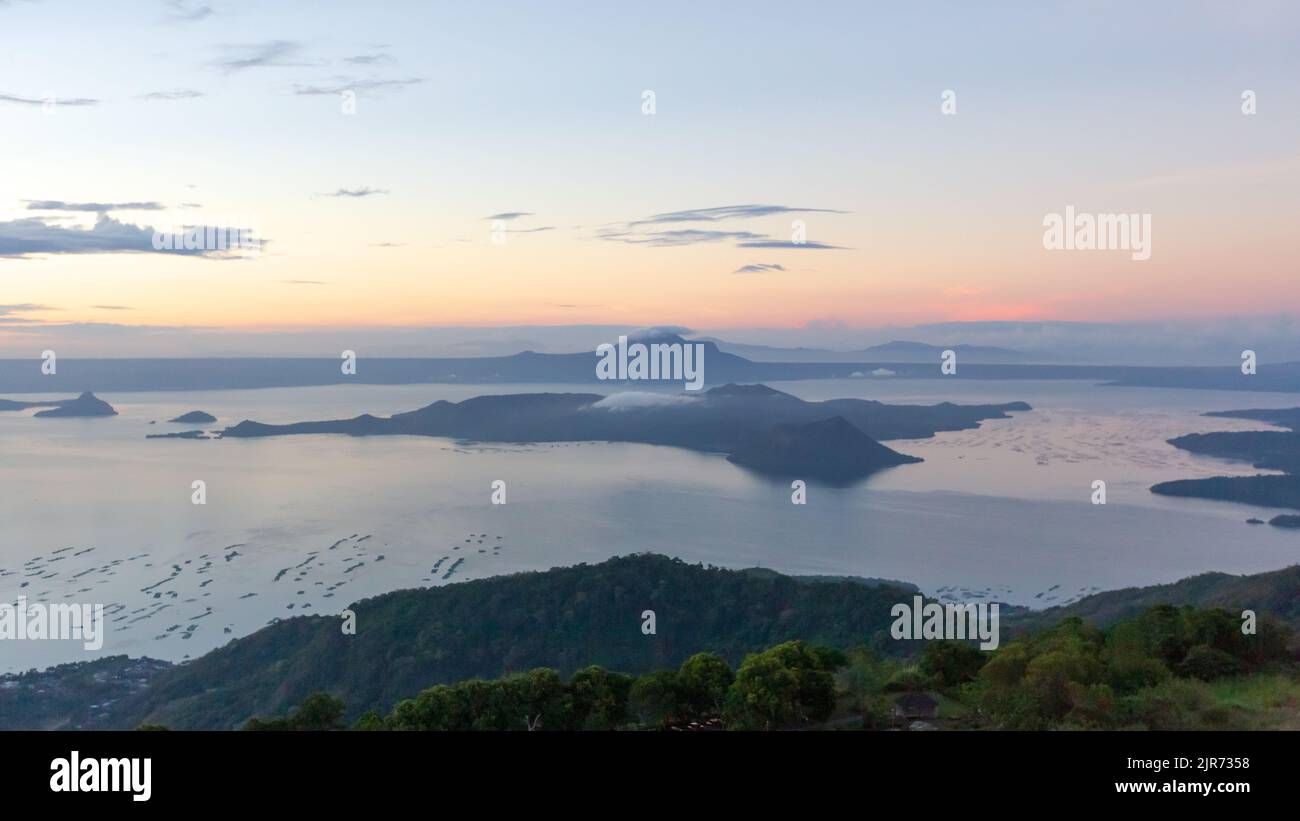 A landscape view of Taal Volcano in the Philippines with sunset in the ...