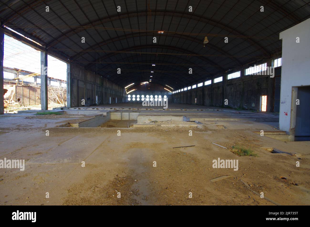 Old abandoned and decaying factory, now everything is corroded by rust ...