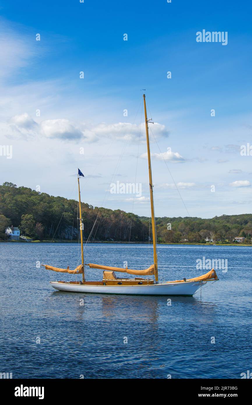 A classic wooden ketch moored in the bend of the Mystic river Stock ...