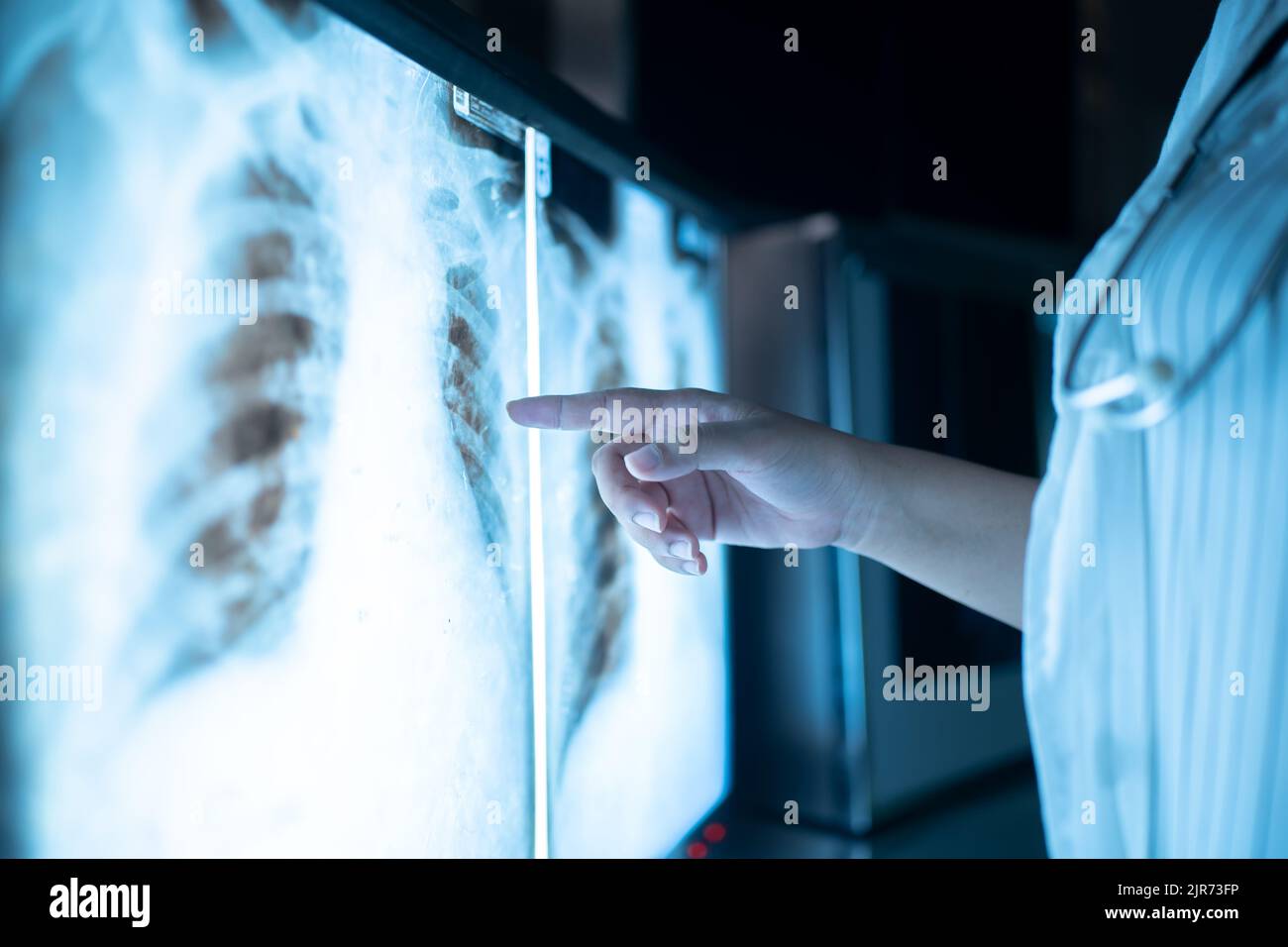 doctors looking at some lab results on monitors, in an office at the ...