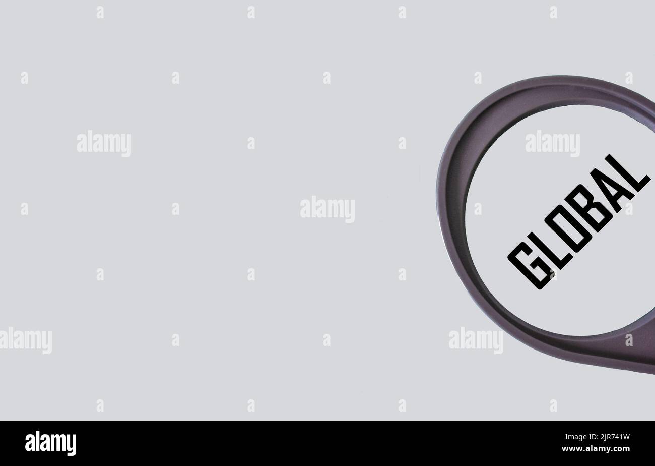 Global symbol on a magnifier and white background. Business and local ...