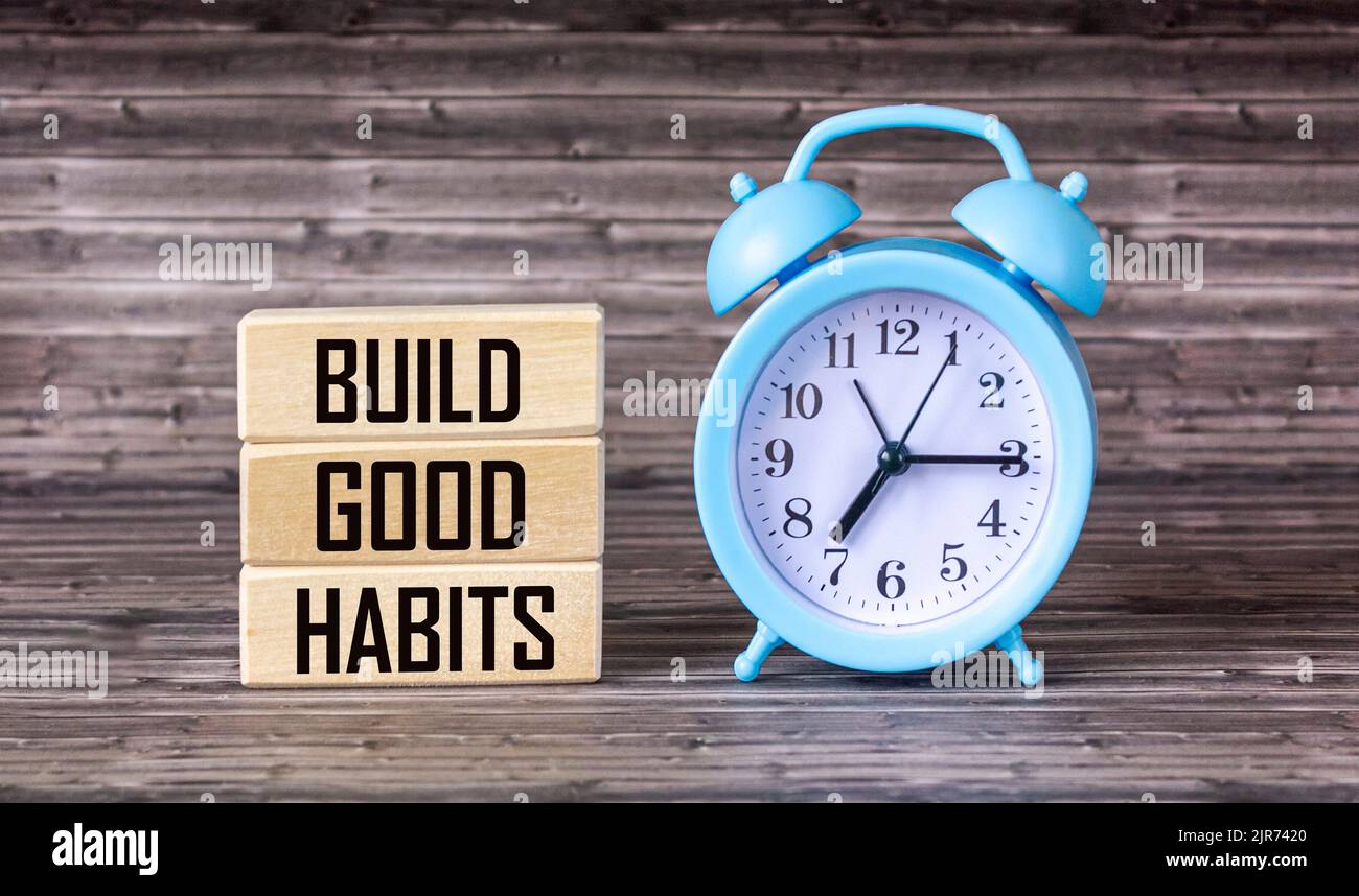 Symbol of good habits. Wooden blocks with the words Create good habits ...