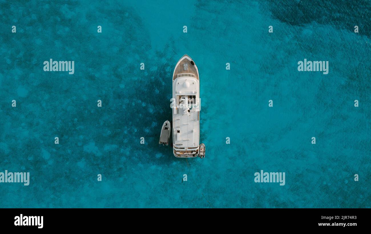Aerial view of yacht with its tenders at anchor Stock Photo - Alamy