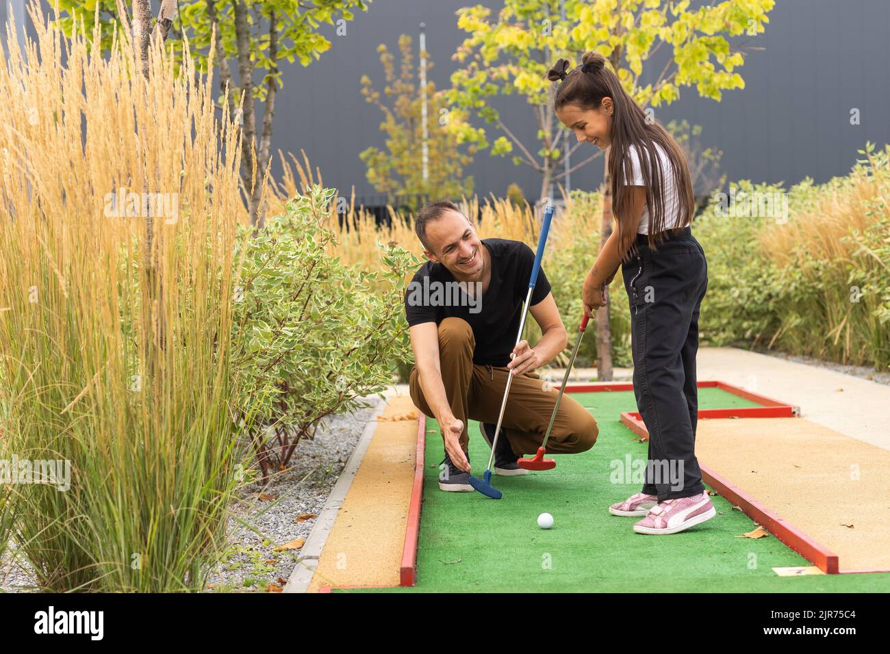 Kids playing mini golf hi-res stock photography and images - Alamy