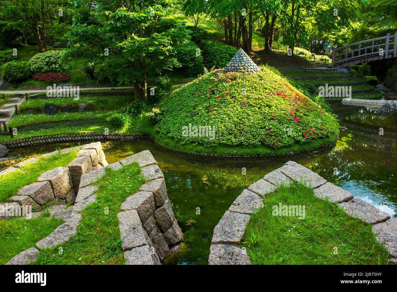 Small pyramid with terminal (or not beginning) azalea flowers and ...