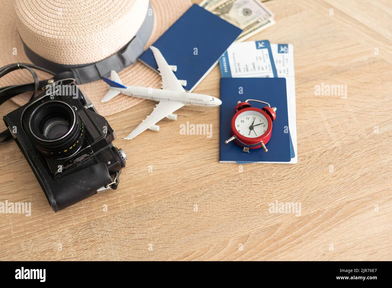 Travel concept. Airplane model, camera and passport on the table Stock ...