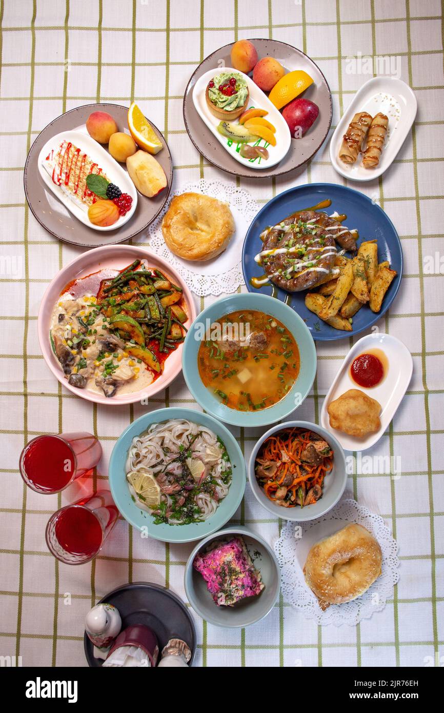 Top view of a table full of food in a cafe Stock Photo - Alamy