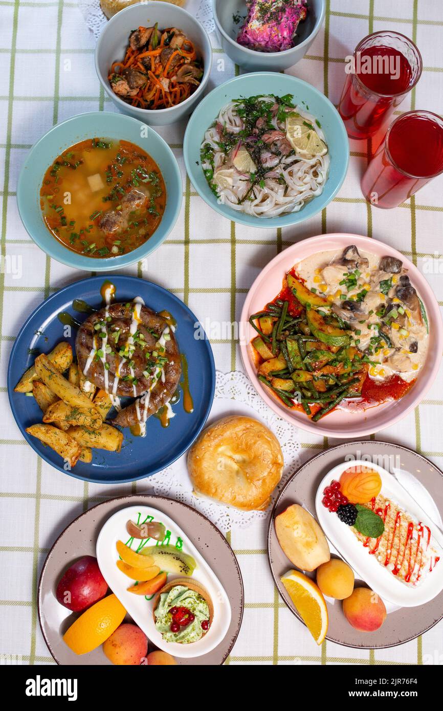 Top view of a table full of food in a cafe Stock Photo - Alamy