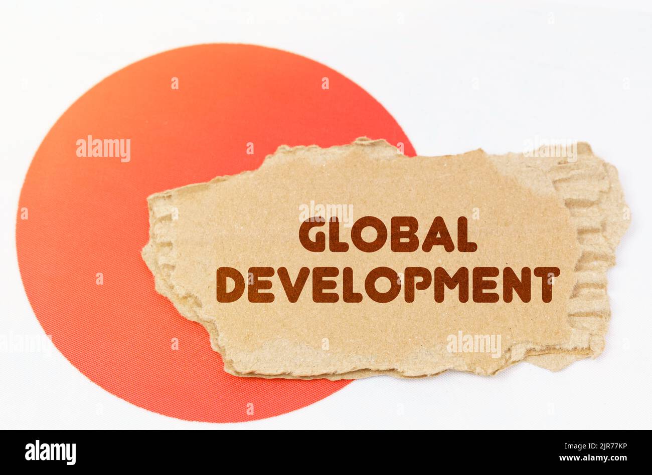 National economy concept. On the flag of Japan lies a notebook with the ...