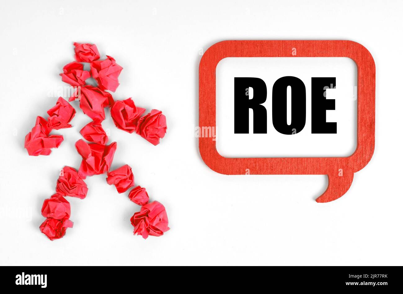 Business concept. On a white background, a red paper man and a sign ...