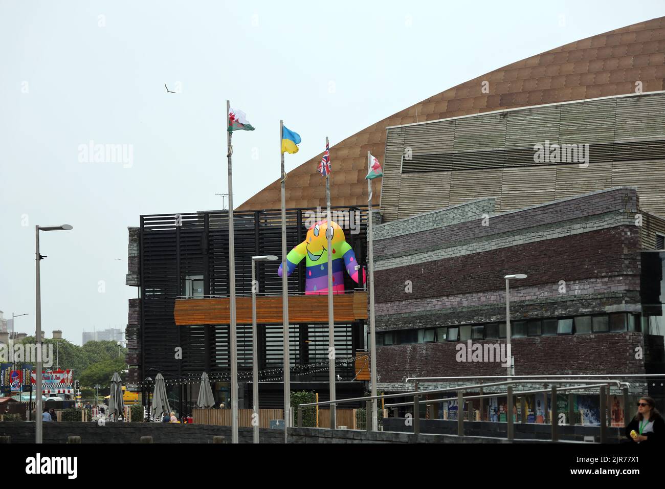Millennium Centre, cardiff Bay with multicoloured inflatable man on ...