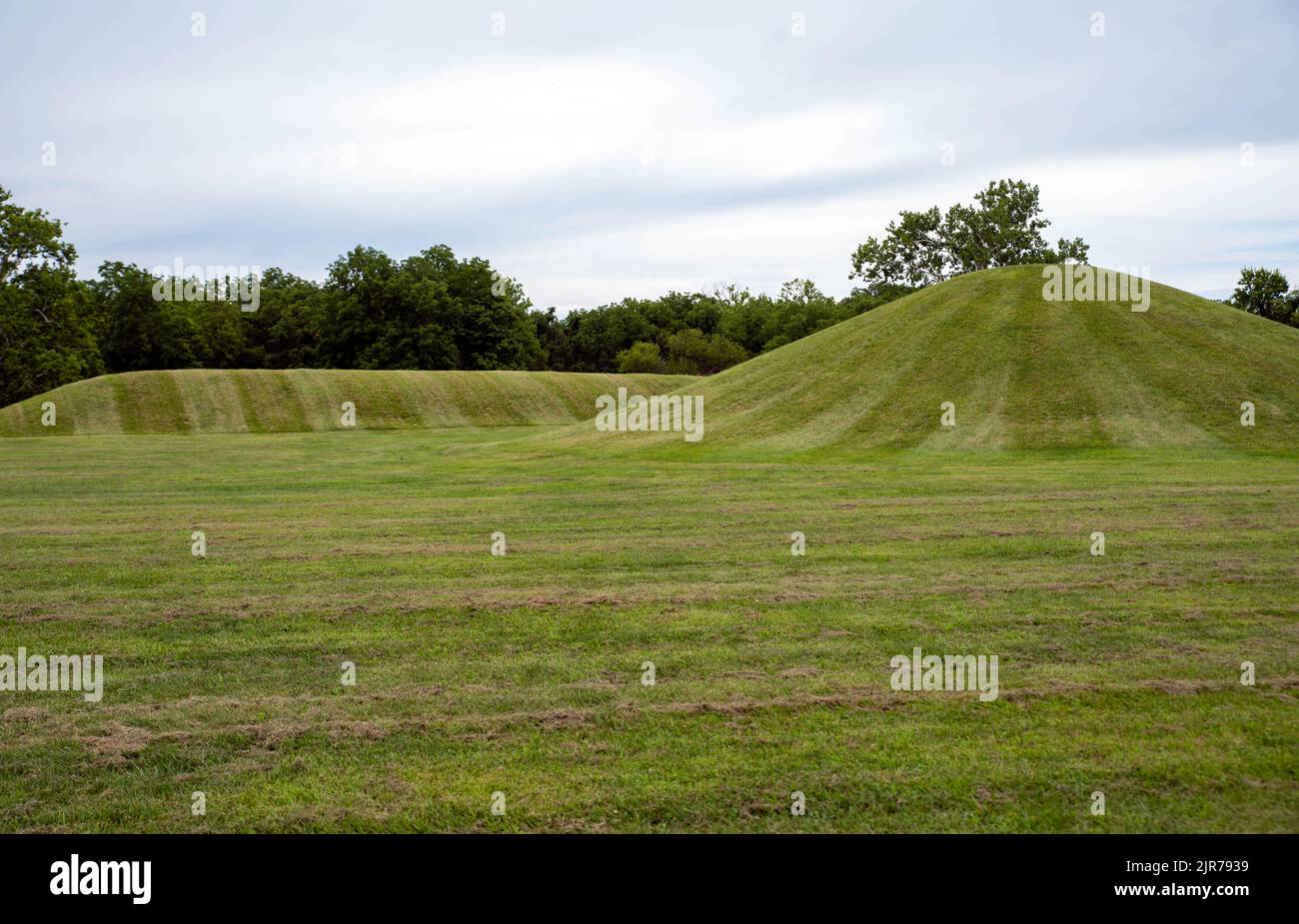 Prehistoric Native American grass covered earthworks burial mounds in ...