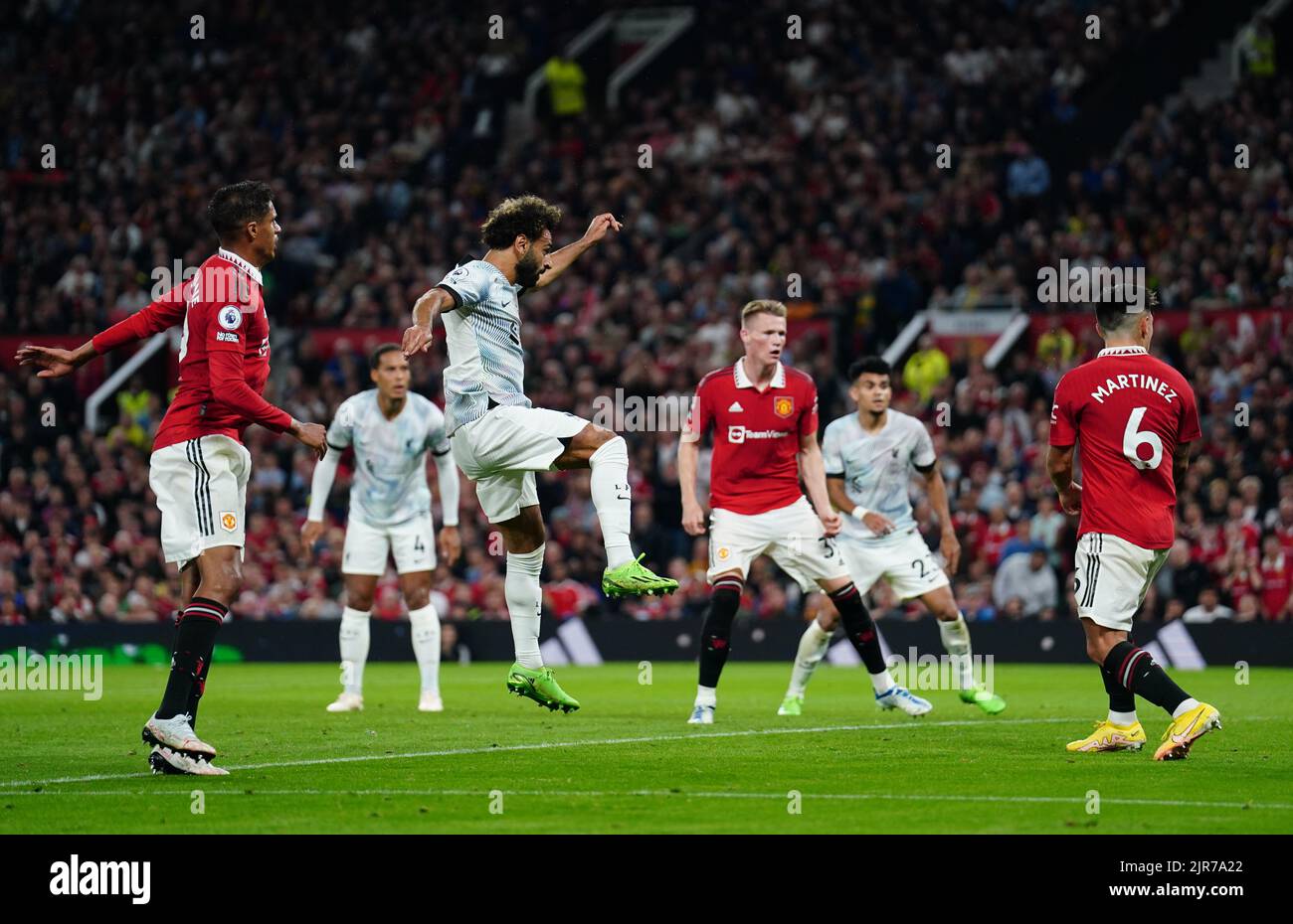 Liverpool's Mohamed Salah scores their side's first goal of the game ...