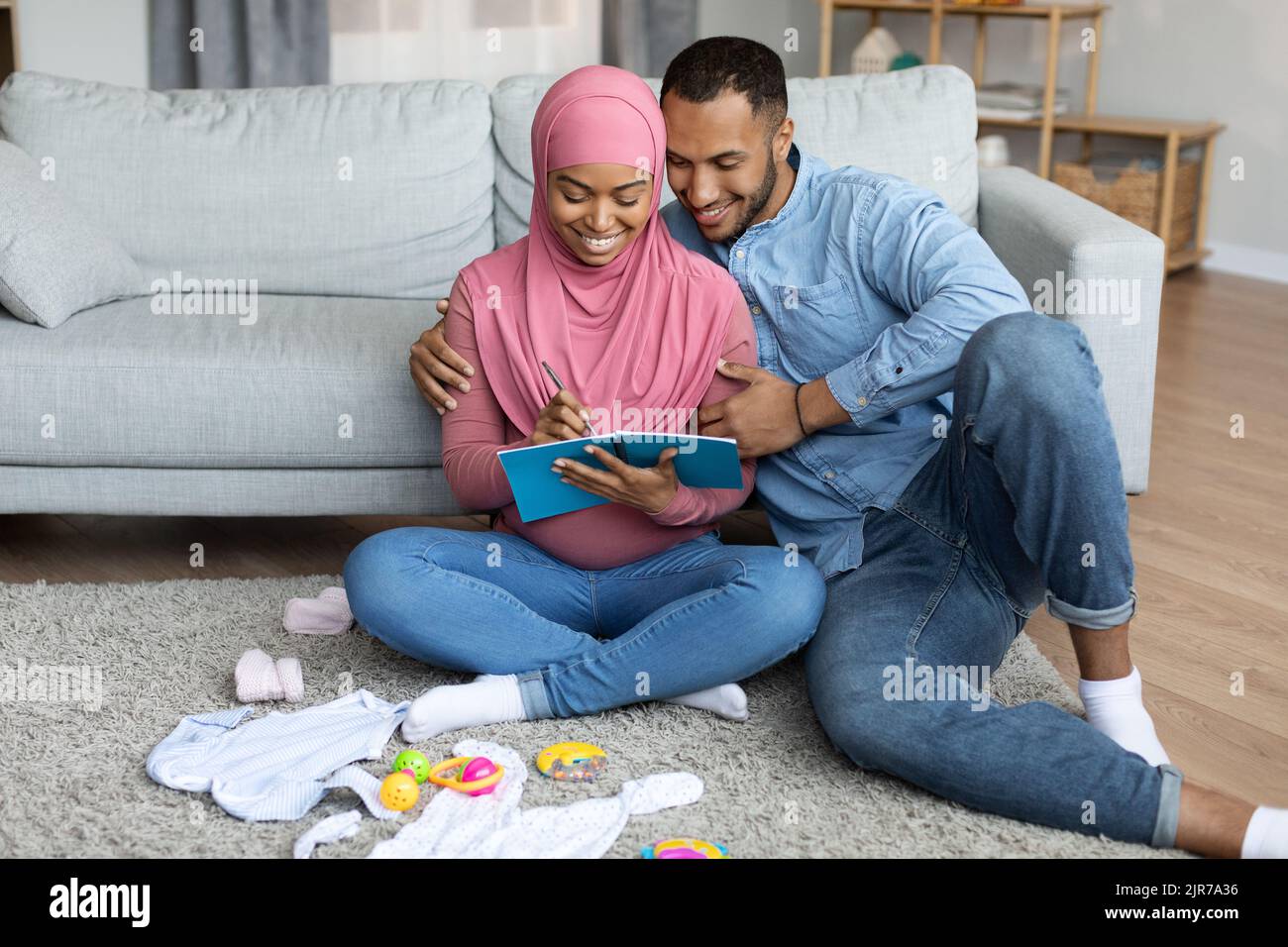Preparing For Childbirth. Pregnant Muslim Spouses Making Checklist Of ...
