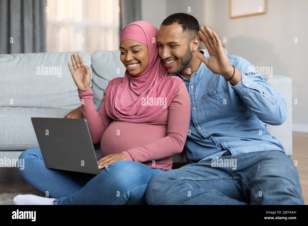 Black Muslim Spouses Expecting Baby Making Video Call With Laptop At ...