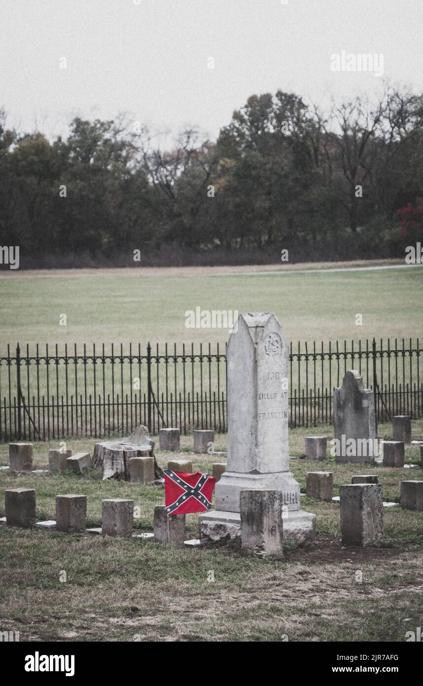 A vertical shot of a flag of the Confederate States of America at a ...