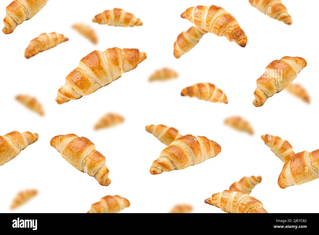 Falling croissant, isolated on white background, selective focus Stock ...