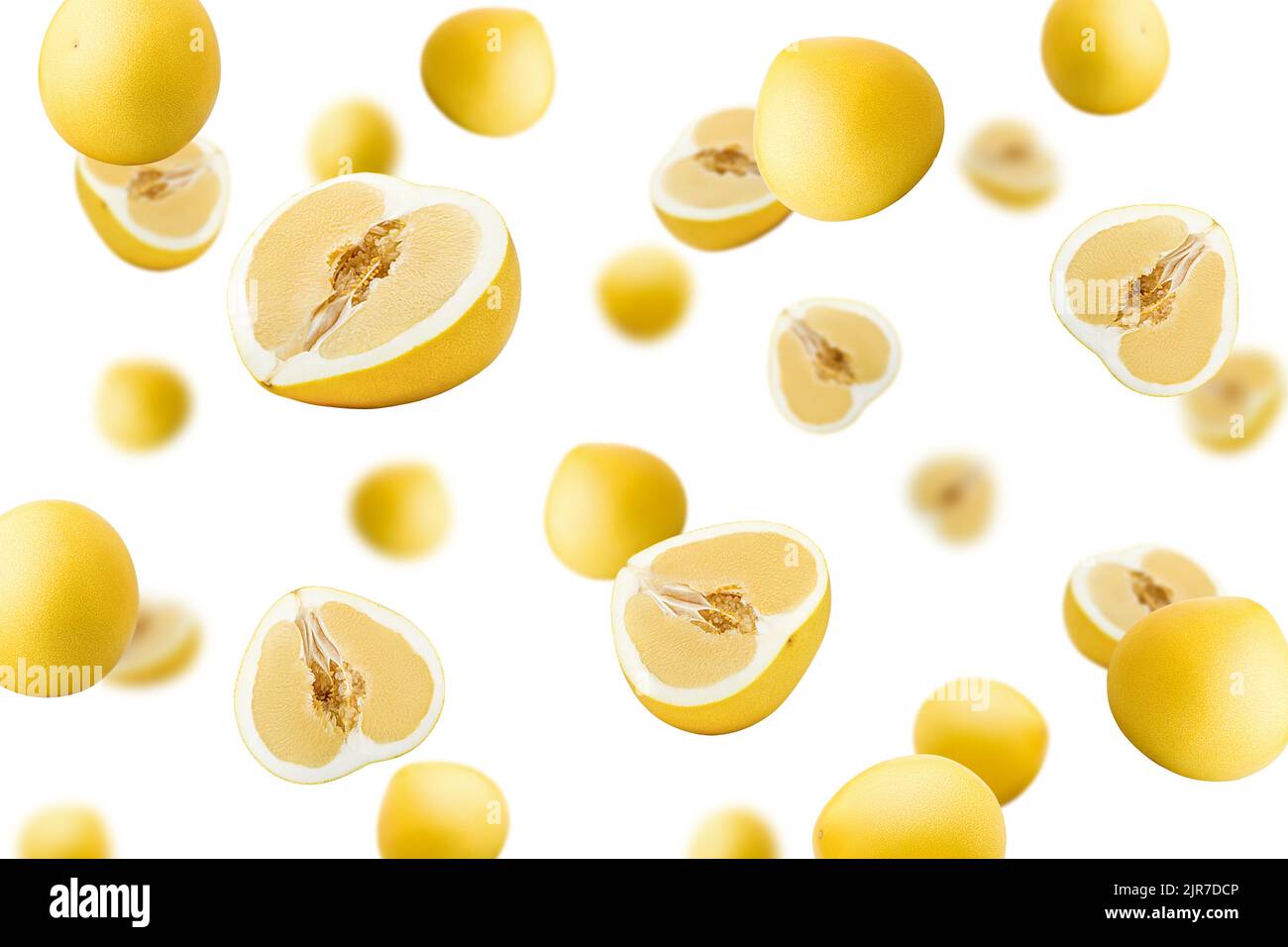 Falling yellow pomelo, isolated on white background, selective focus ...